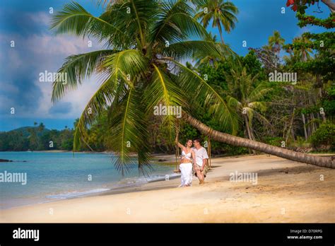 Couple Sitting In Tree Caribbean Hi Res Stock Photography And Images Alamy