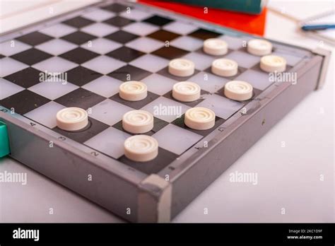 checkers game pieces are placed on game board and everything is ready for start of set stock