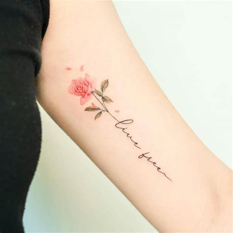 Rose And Live Free Tattoo Located On The Inner Arm