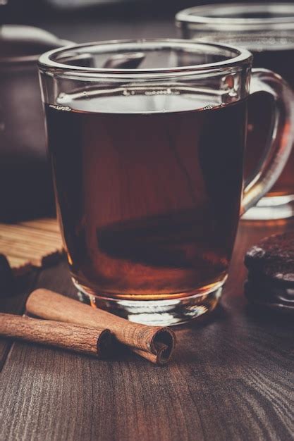 Premium Photo Cup Of Tea With Cinnamon Sticks