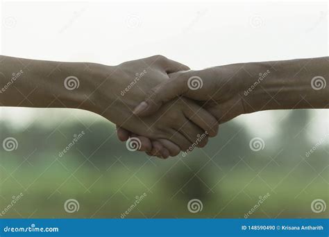 Two Hands Shaking Each Other Teamwork And Helping Concept Stock Photo