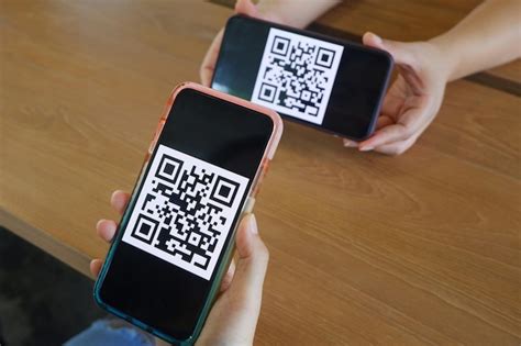 Premium Photo Scanning Qr Code Via Mobile Phone Wireless Technology
