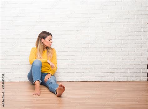 Girl Sitting Against Wall Side