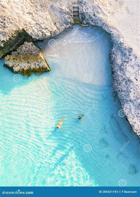 A Couple Of Men And Women On The Beach Of Tres Trap Aruba Caribbean
