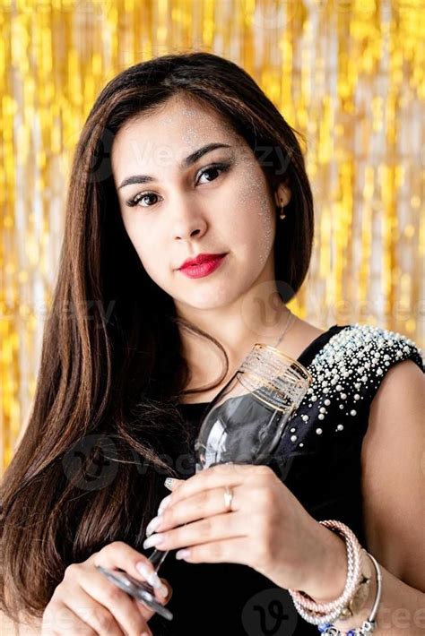 Download Woman Celebrating Her Birthday Holding Champagne Flute For Free