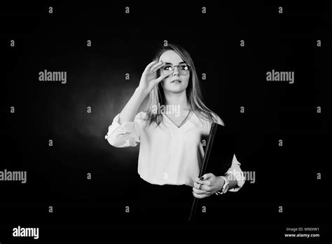 Studio Portrait Of Blonde Businesswoman In Glasses White Blouse And