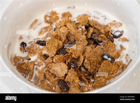 Bowl Of Raisin Bran Cold Cereal With Milk Breakfast Food In A White