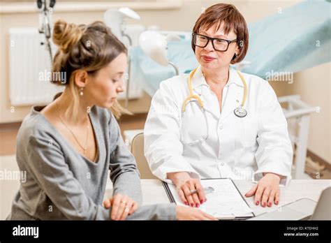 Young Woman Patient With A Senior Gynecologist During The Consultation