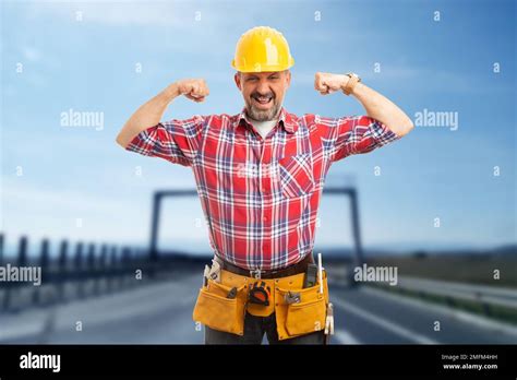 Positive Worker Making Tension Gesture With Hands As Success Concept On