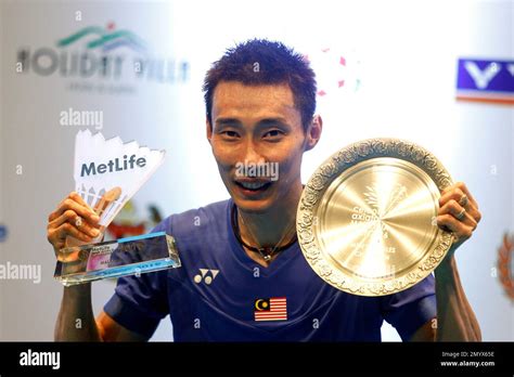 Lee Chong Wei Of Malaysia Poses With His Trophy For A Photo After