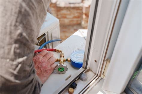 A Man Installs An External Air Conditioner Dangerous Work Stock Image Image Of Mechanical