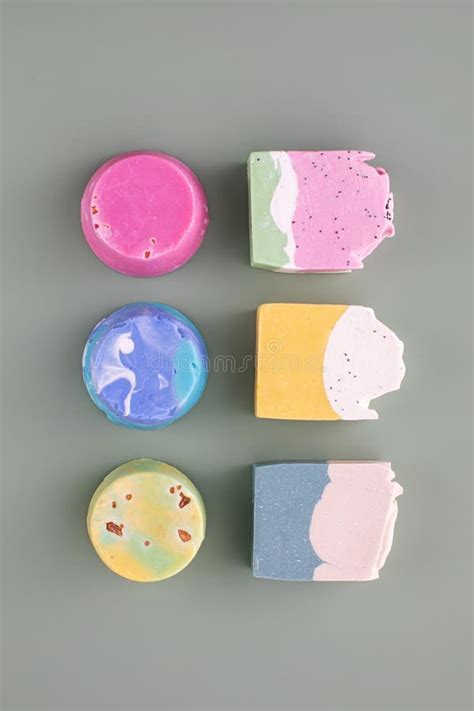 Pieces Of Different Shapes And Colors Of Handmade Soap On A Green Background Natural Cosmetics