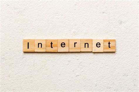 INTERNET Word Written On Wood Block INTERNET Text On Cement Table For