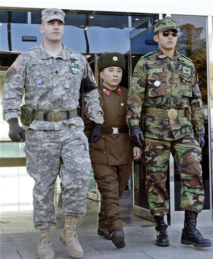 A Damn Commie North Korean Soldier Between A South Korean Soldier And