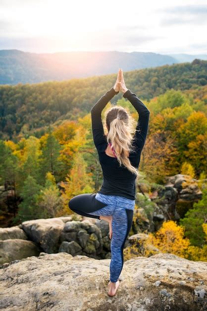 Premium Photo Sporty Fit Woman Is Practicing Yoga On The Top Of The