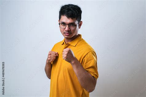 Asian Man Punching Fist To Fight Aggressive And Angry Attack Threat