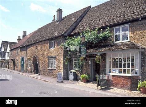 Historical Old Buildings In Lacock Village Street Bakery Shop And Quaint