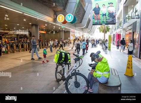 Uber Eats Delivery Riders Take A Break Beside Sydney Chatswood