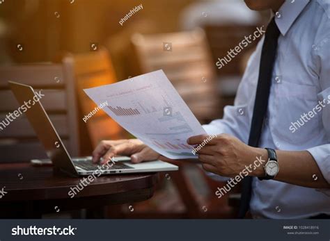 Businessmans Key Research And Audit Income Statement Data From Excel