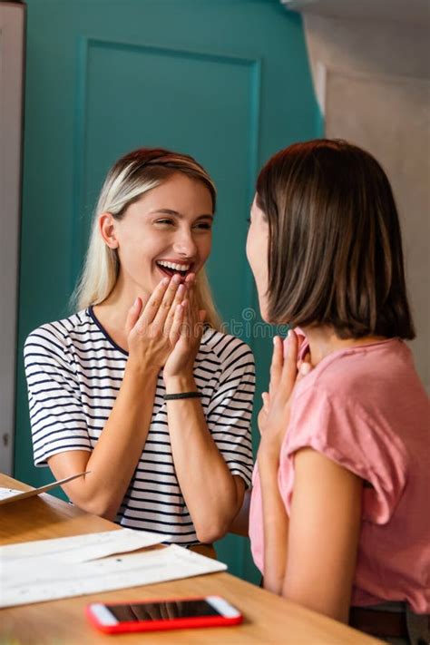 Portrait Of Two Beautiful Women Having Fun Together And Chatting In