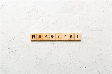 Referral Word Written On Wood Block Referral Text On Cement Table For Your Desing Top View