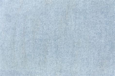 닫기 청바지 배경 블루 데님 청바지 질감 질감 줄무늬 청바지 데님 린넨 패브릭 배경 프리미엄 사진