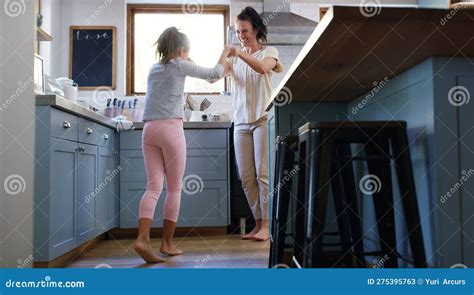 Teaching Mommy Some Moves Full Length Shot Of An Affectionate Young
