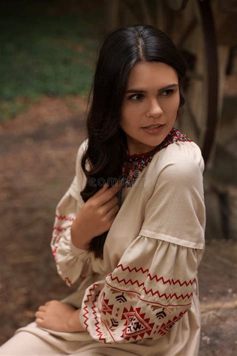 Beautiful Woman Wearing Embroidered Dress In Village Ukrainian National