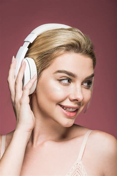 Happy Blonde Girl Listening Music With Headphones Isolated Stock Image