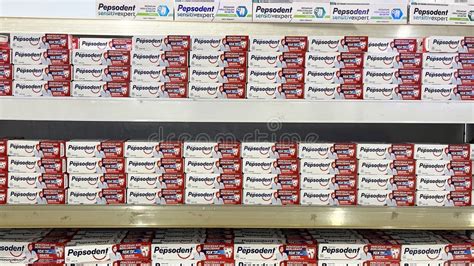 Various Toothpaste In Shelf For Sale At Supermarket Editorial