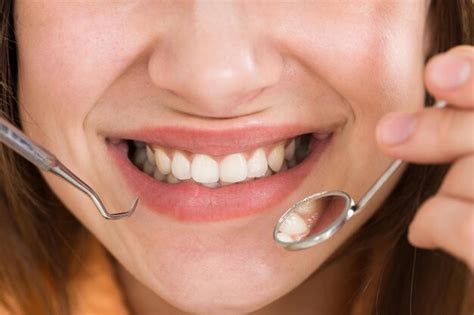 Premium Photo Woman Examining Her Teeth