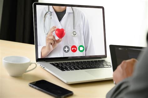 Premium Photo Man Using Laptop On Table