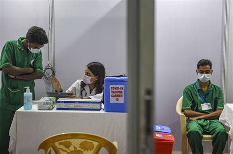 Medics Staff Sit Inside A Vaccination Booth At BKC In Preparation For