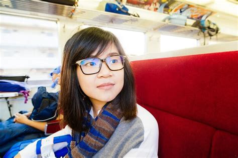 Premium Photo Woman Wearing Eyeglasses Sitting In Train