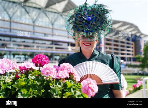 A Racegoer Arrives For Day One Of Royal Ascot At Ascot Racecourse