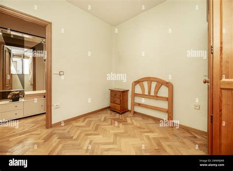 Empty Room With Some Wooden Furniture Glossy Varnished Parquet Floor