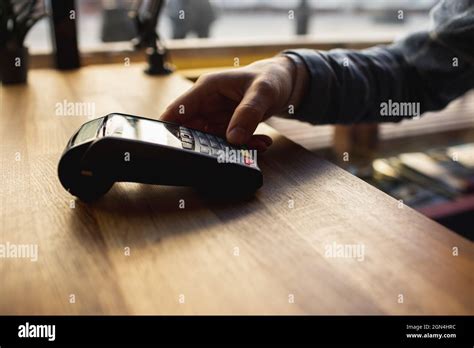 Man Enters Data Into A Mobile Terminal Stock Photo Alamy