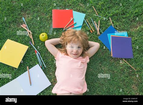 Portrait Of Cute Smart Clever Babe Babe Nerd Doing Homework Lie On Grass Stock Photo Alamy