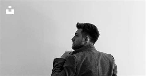 Man Facing Back In Front Of Wall Photo Free Apparel Image On Unsplash