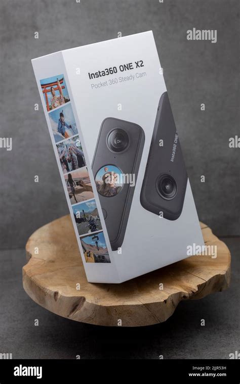 Insta360 One X2 New Package Camera Box On A Wooden Display Stand Against A Modern Contemporary