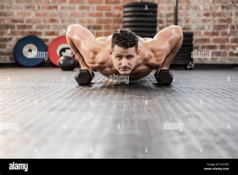 Portrait Of Man Doing Dumbbell Push Ups Stock Photo Alamy