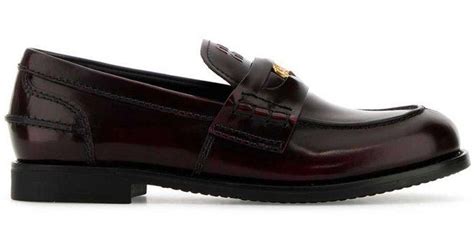 Miu Miu Logo Embossed Slip On Penny Loafers In Black Lyst