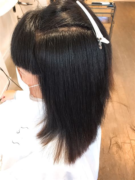 お客様施術。酸性縮毛矯正で髪質チェンジ 岡山の縮毛矯正専門美容師 関 竜哉