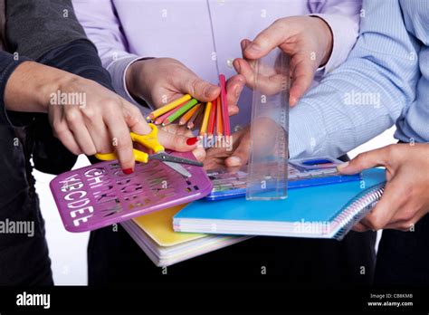 Group Of Hands Holding Education Objects Selective Focus Stock Photo Alamy