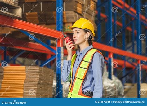 Warehouse Worker Working In Factory Warehouse Industry And Using Radio