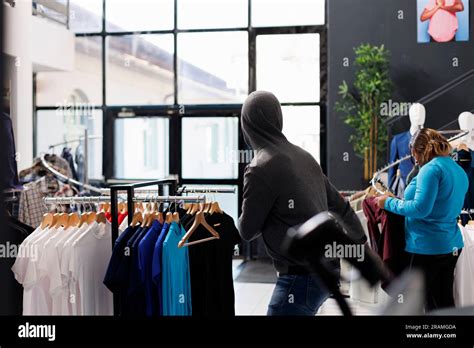 African American Man Thief Stealing Shirt And Running From Modern
