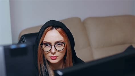 Premium Photo Revealing Shot Of Wanted Female Hacker Using Super Computer To Write A Malicious