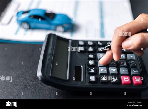Car Dealer Calculate Interest Rate And Costs Of Car Loan With Calculator Explaining Details To