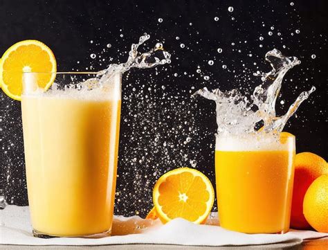 Premium Photo | Orange juice splash in glass
