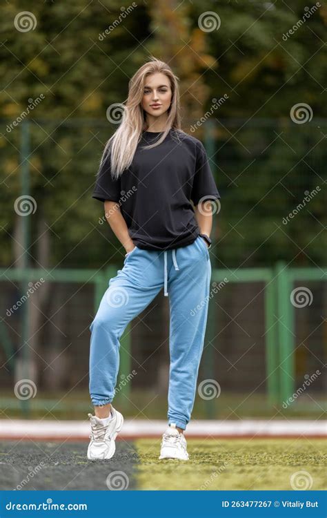 Sporty Blonde Woman In Oversized Clothes Posing Outdoor Stock Image